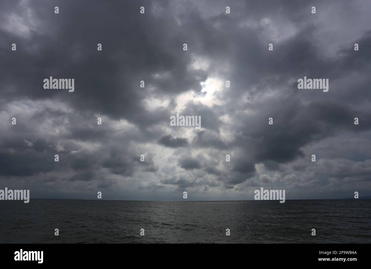 Dark sky background, the sea in the storm, the rain is coming and the ...
