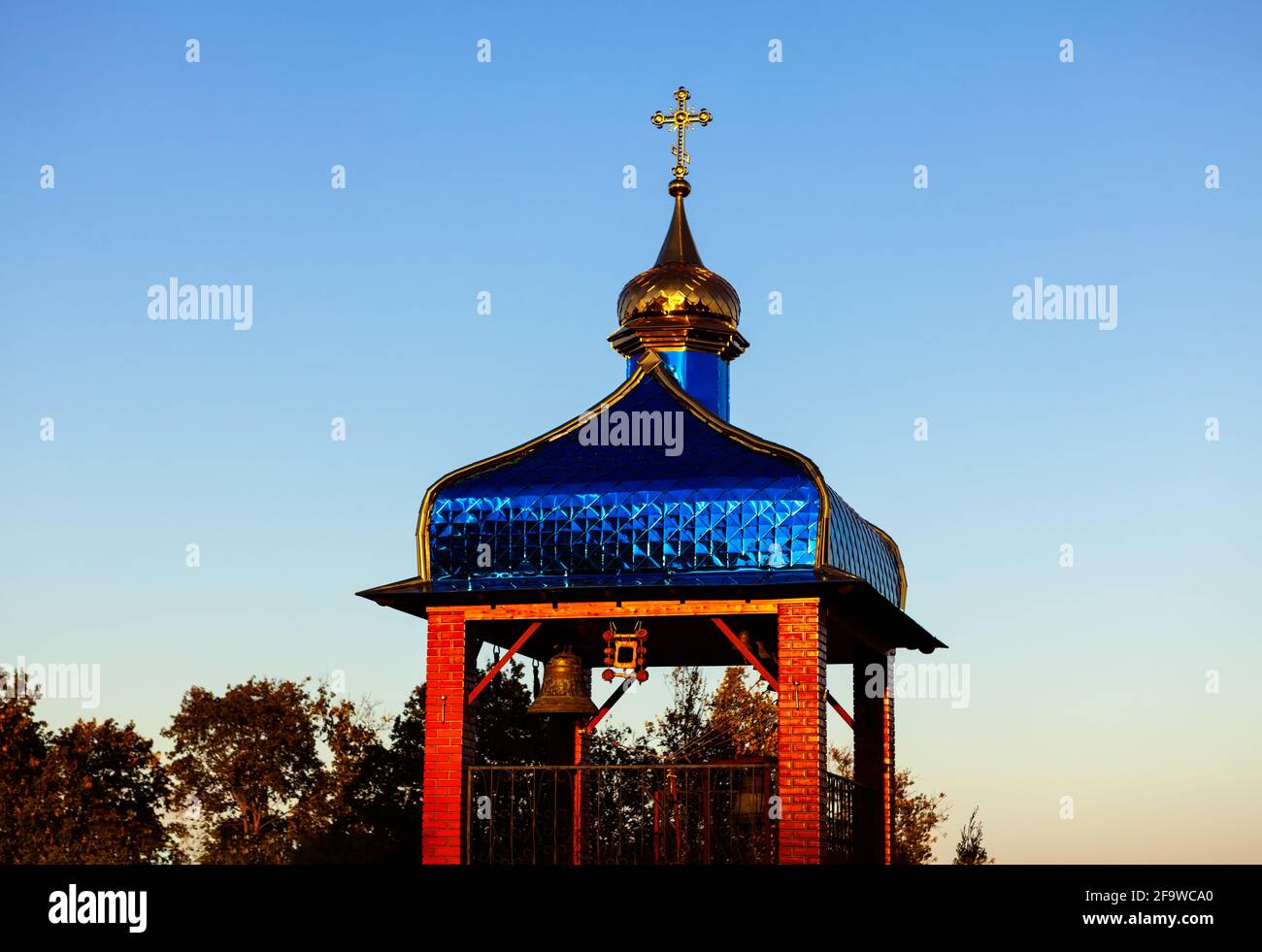 Bell tower with cross on the top Stock Photo - Alamy