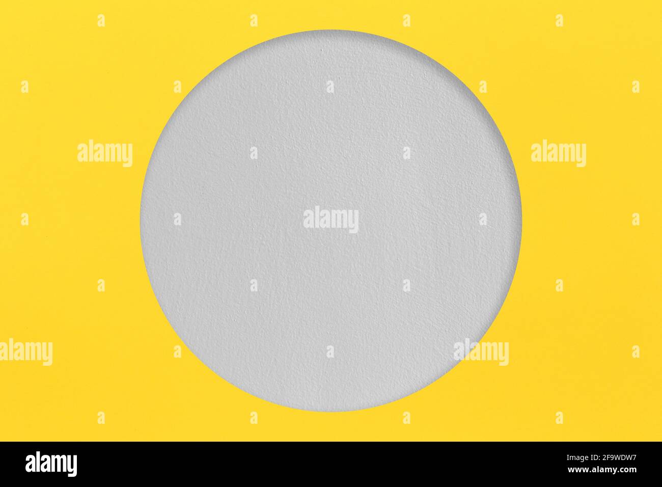 Yellow paper is placed on top of the Gray paper and circle shape for ...