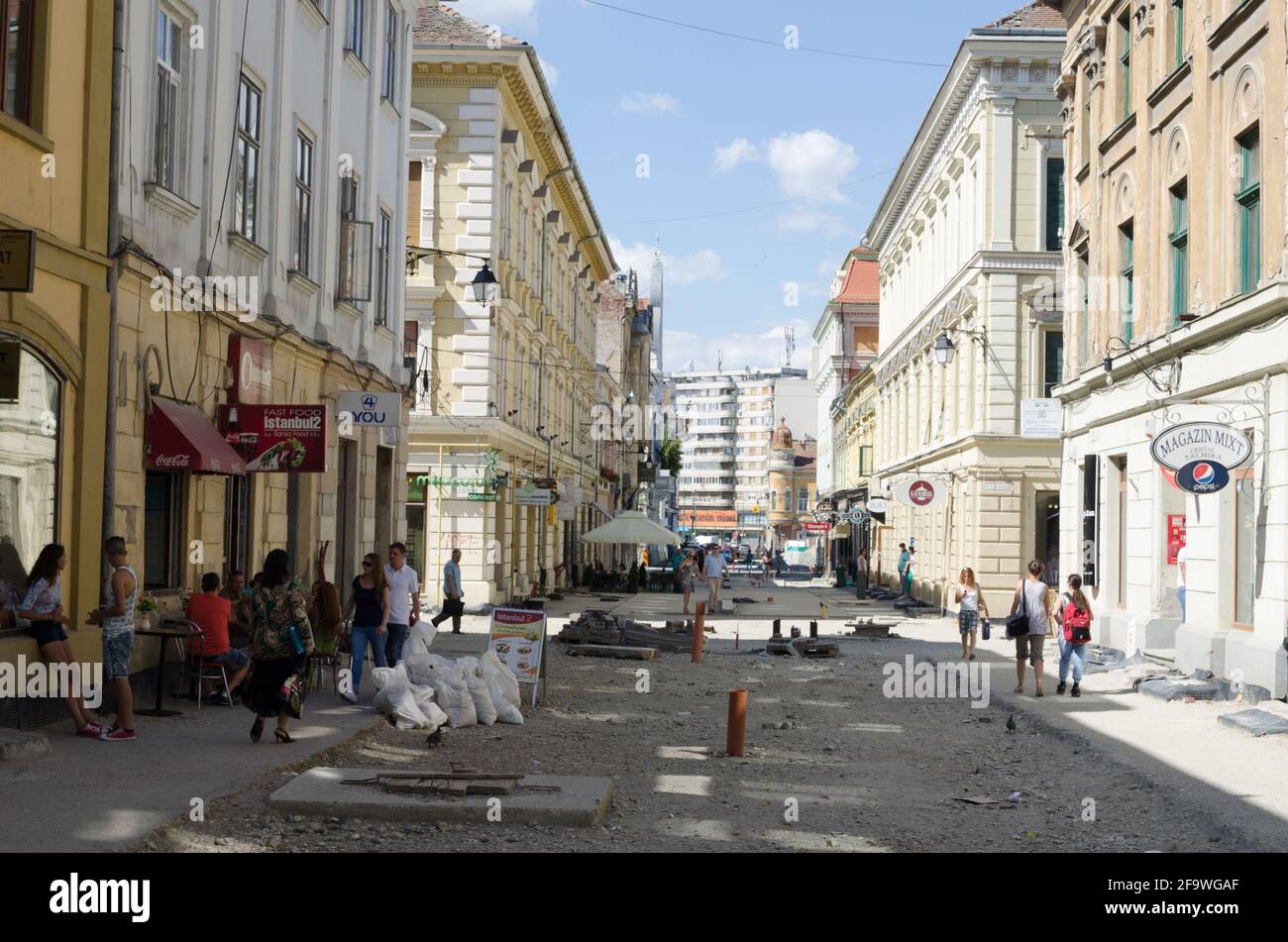 TIMISOARA, ROMANIA, JULY 4, 2015: People are strolling through narrow ...