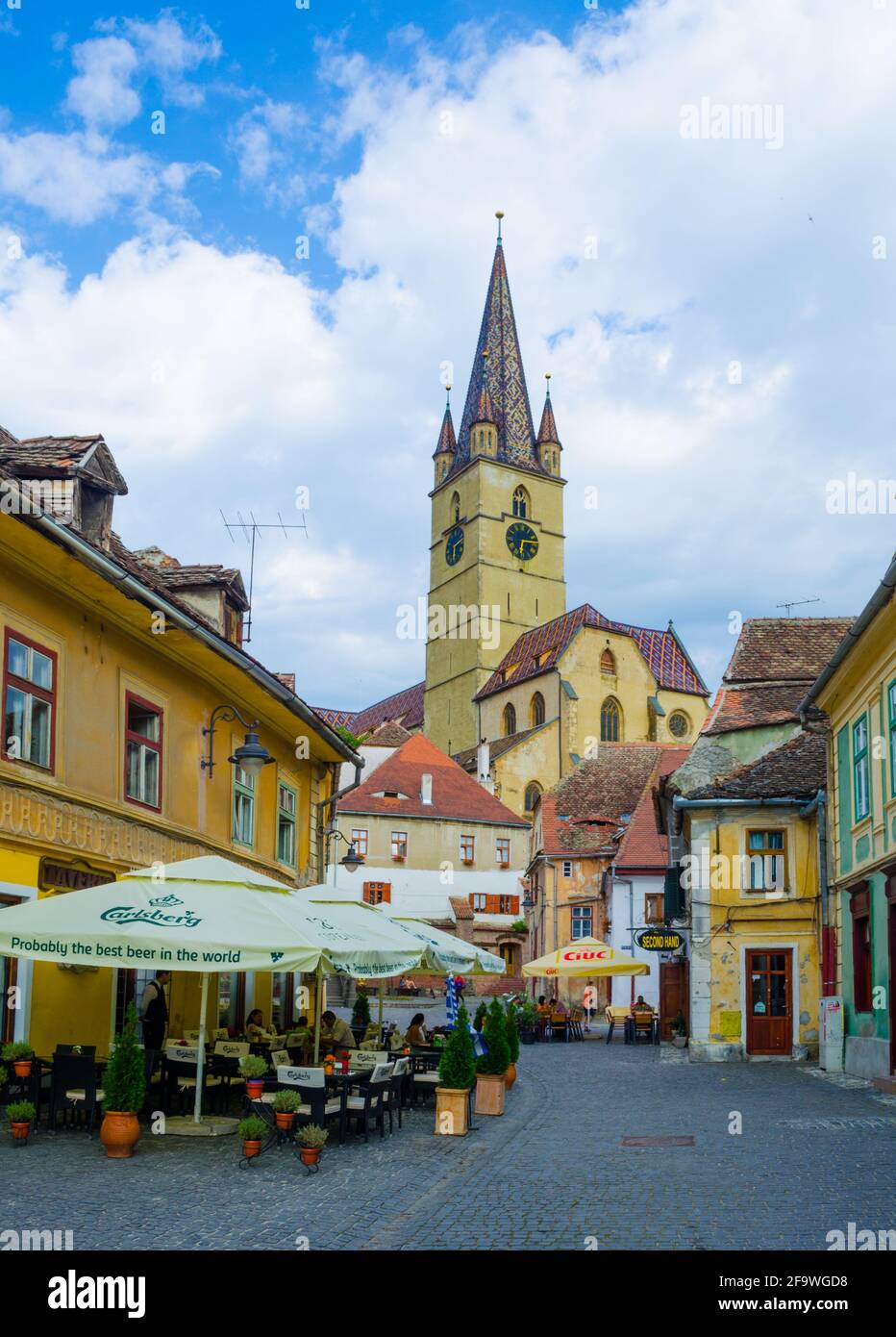 SIBIU, ROMANIA, JULY 6, 2015: people are enjoying lunch in a restaurant ...