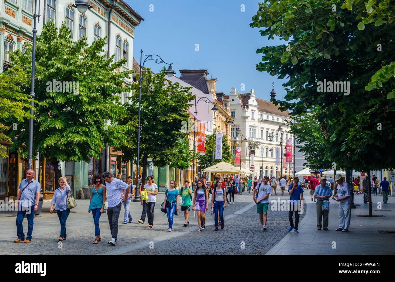 SIBIU, ROMANIA, JULY 6, 2015: people stroll along the boulevard nicolae ...