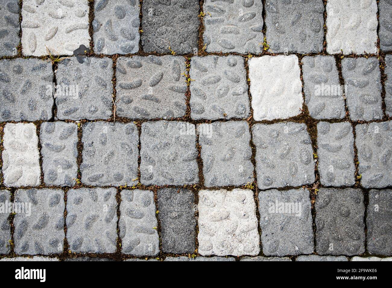 The road is paved with gray stones, top view. stone texture, outdoor ...