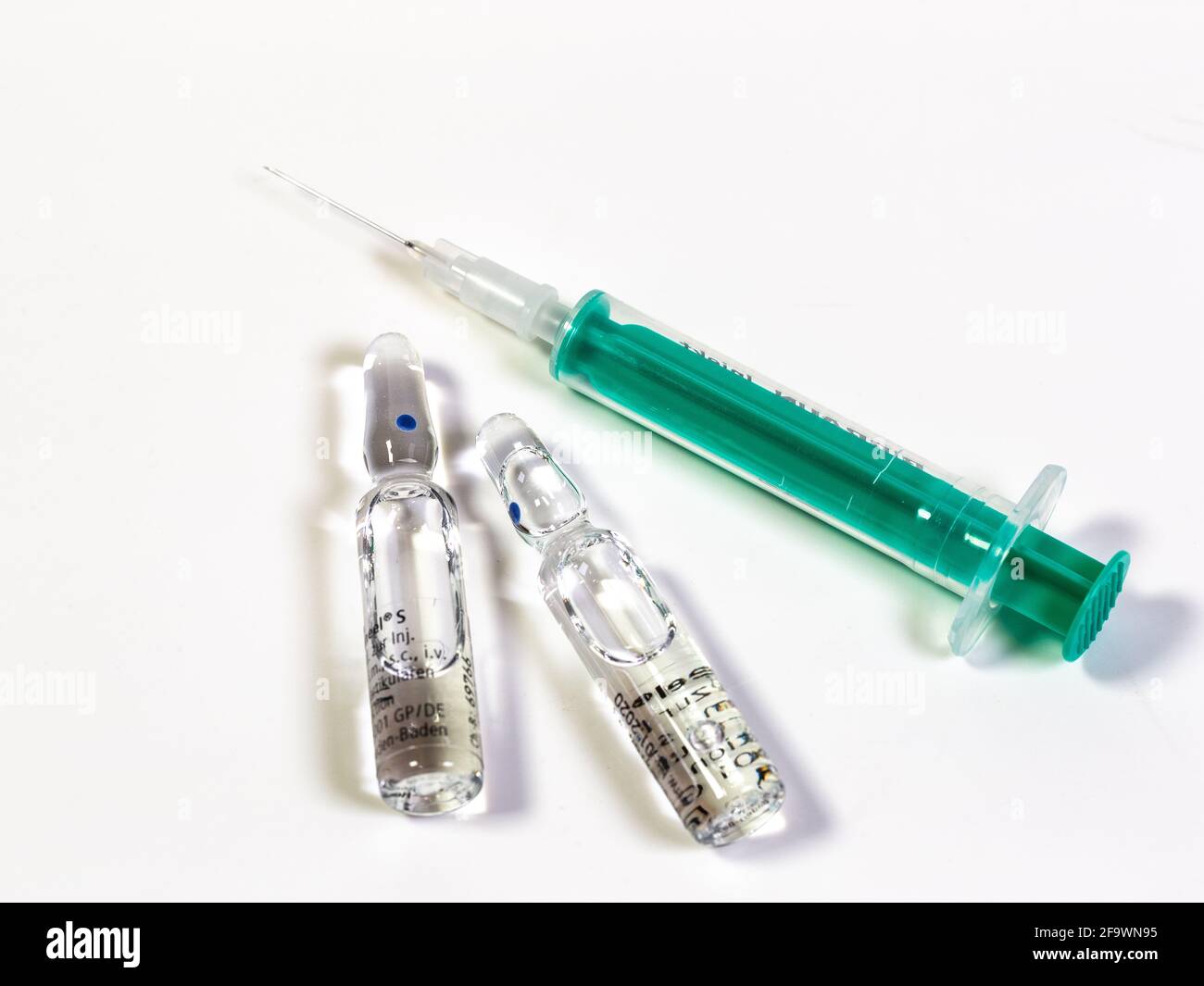 a syringe and ampules on white background Stock Photo - Alamy