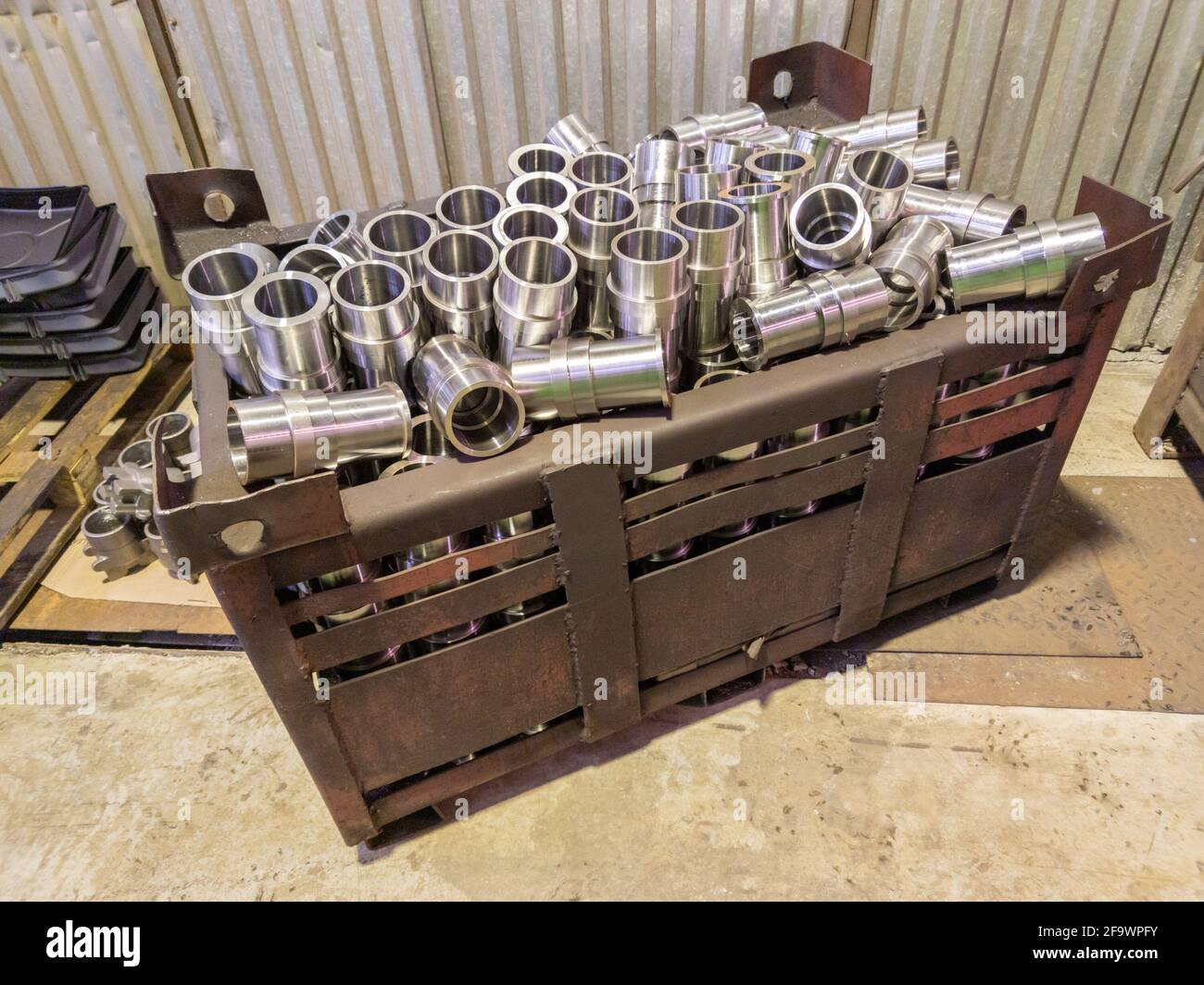 shiny steel parts overflowing big intermodal steel container box on ...
