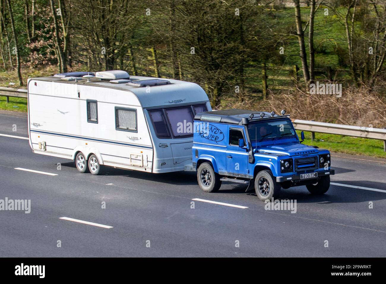 2001 blue Land Rover Defender; towing Laser caravan 600/4 moving ...