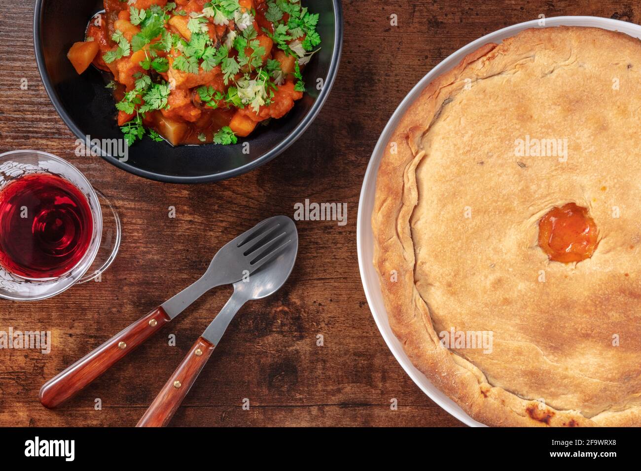 Portuguese cuisine. Alentejo style pork with porto sweet wine and a ...