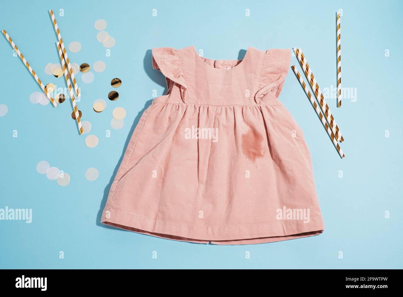Stain on a pink dress with party attributes. concept of daily life ...