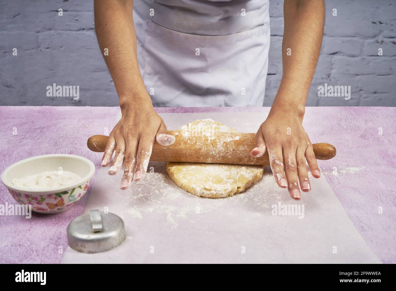 Person flattening dough wooden rolling hi-res stock photography and ...