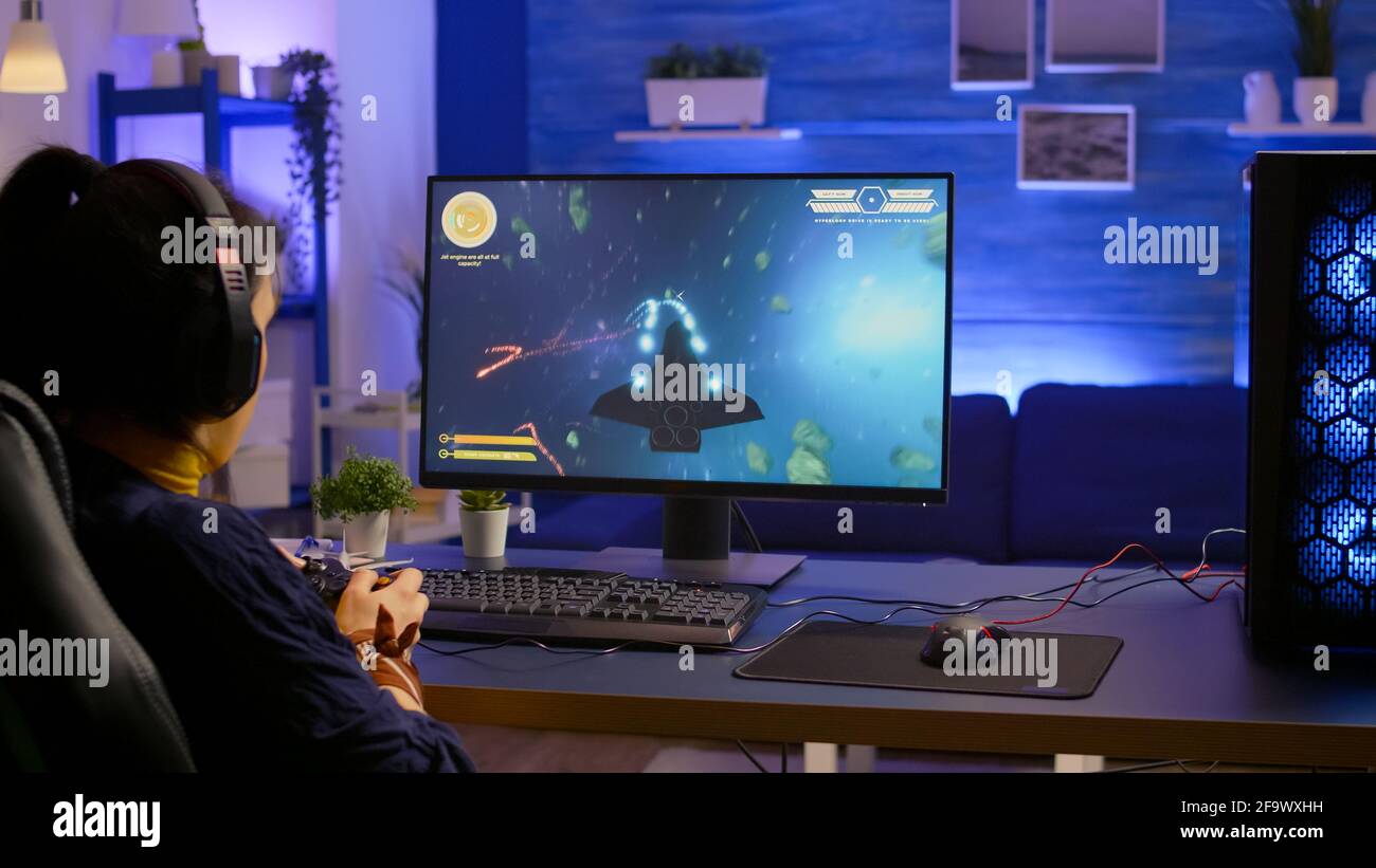 Pro gamer playing space shooter online championship with modern ...