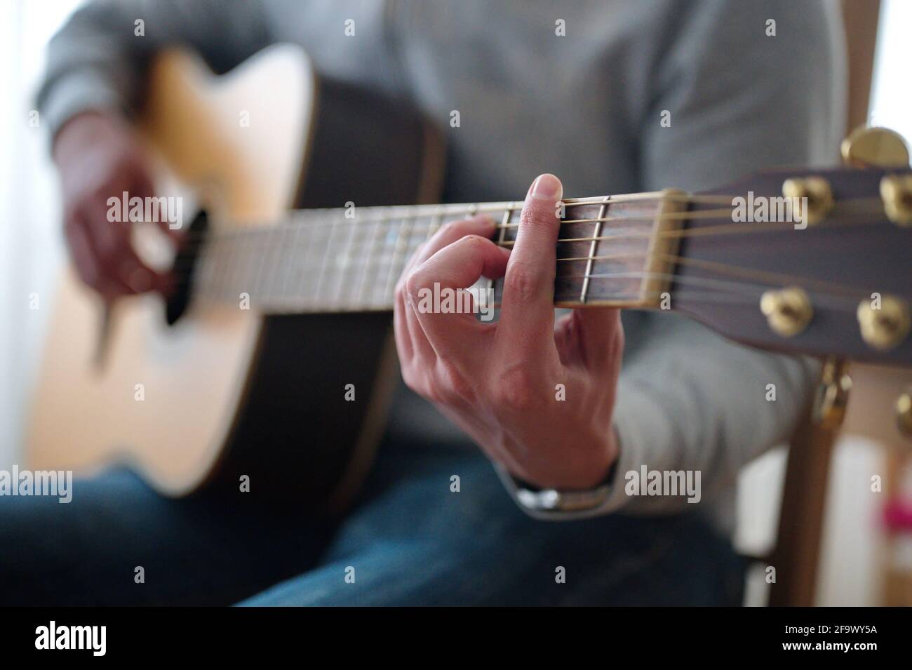 Man playing acoustic guitar hi-res stock photography and images - Alamy