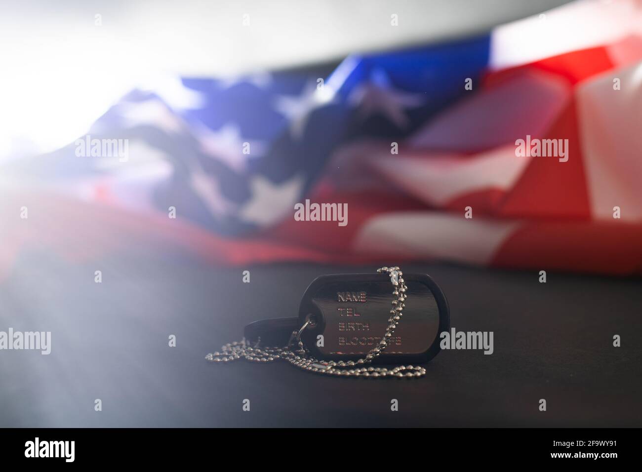 Army tokens on American national flag background Stock Photo - Alamy