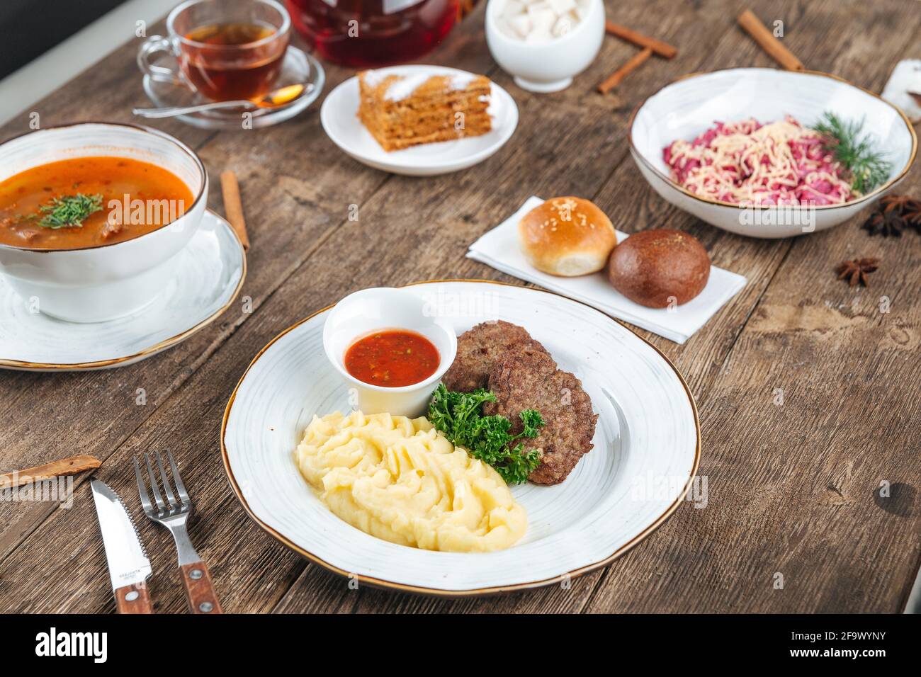 Wooden table served with russian dishes for lunch Stock Photo - Alamy