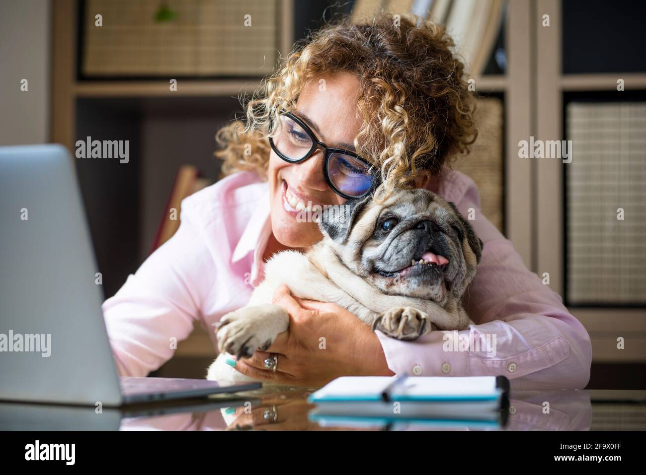 Woman work at home with laptop computer in smart working business ...