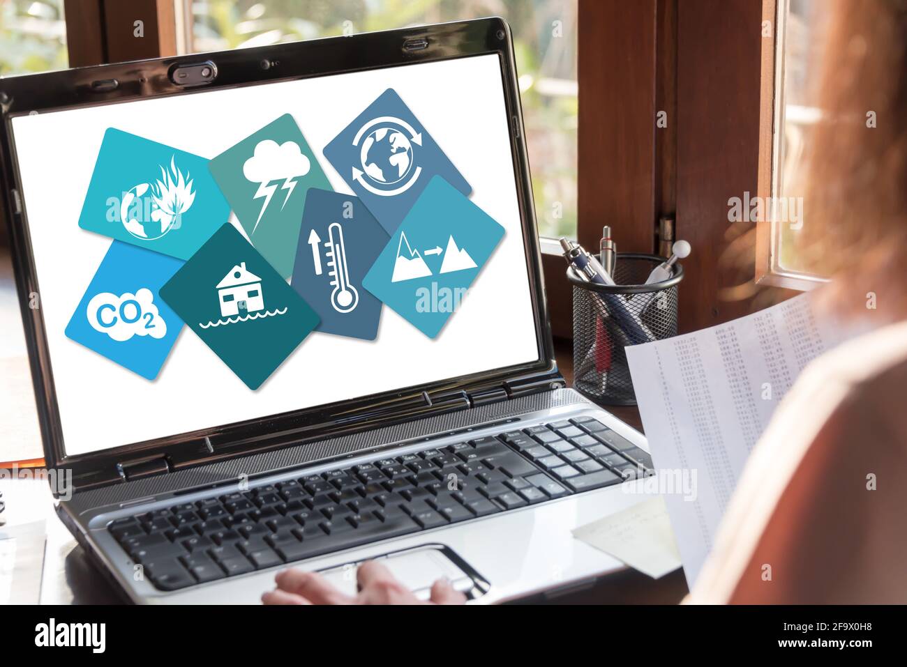 Laptop screen showing climate change concept Stock Photo - Alamy