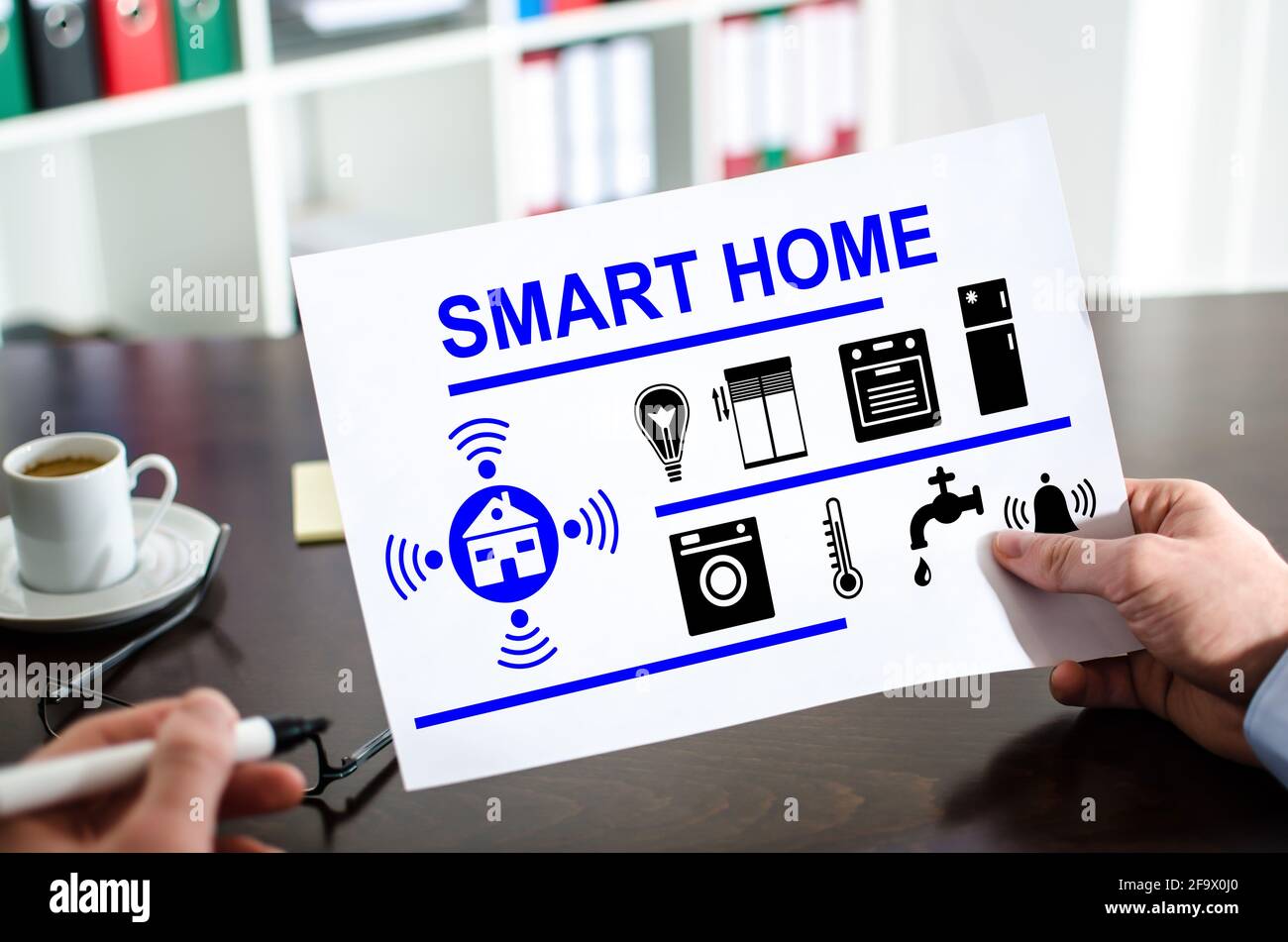 Hand holding a paper showing smart home concept Stock Photo - Alamy