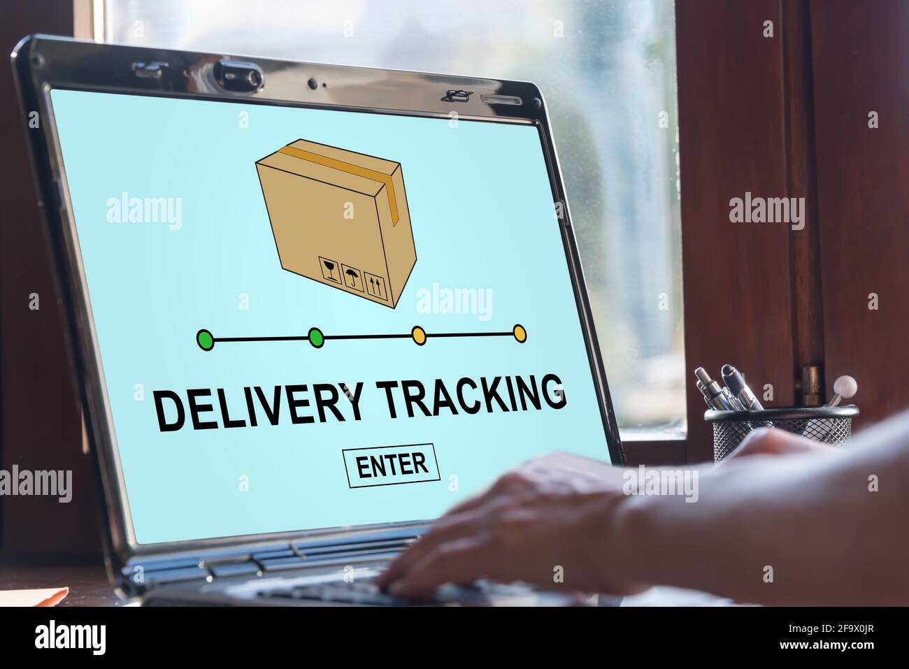 Laptop screen displaying a delivery tracking concept Stock Photo - Alamy