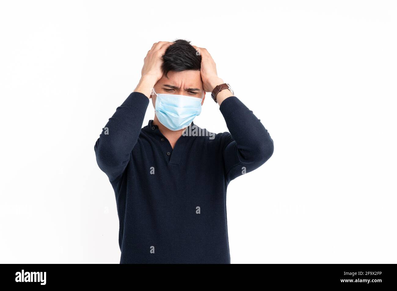 Caucasian man wearing a mask showing the gesture of pain isolated on a ...