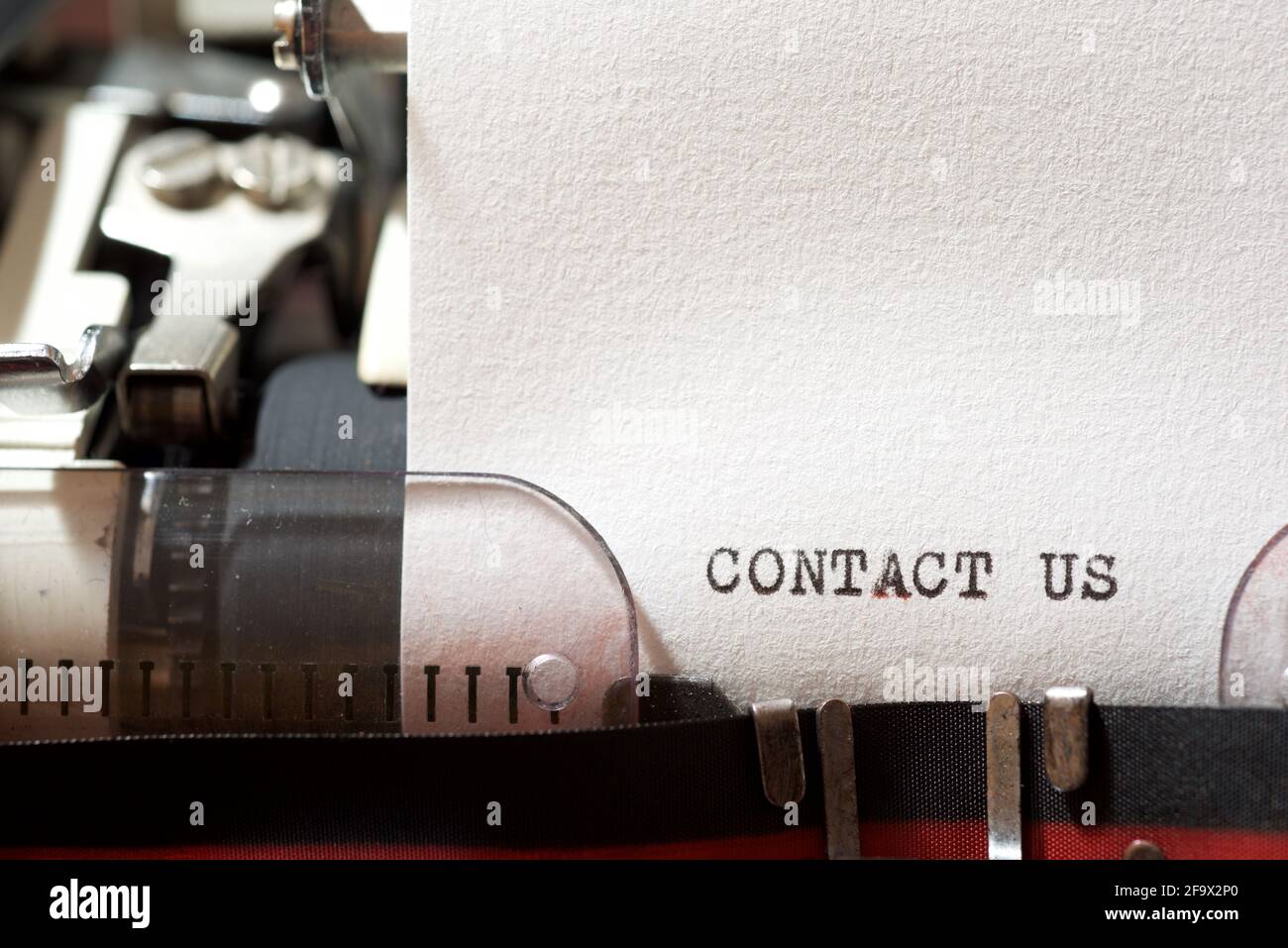 Contact us phrase written with a typewriter Stock Photo - Alamy