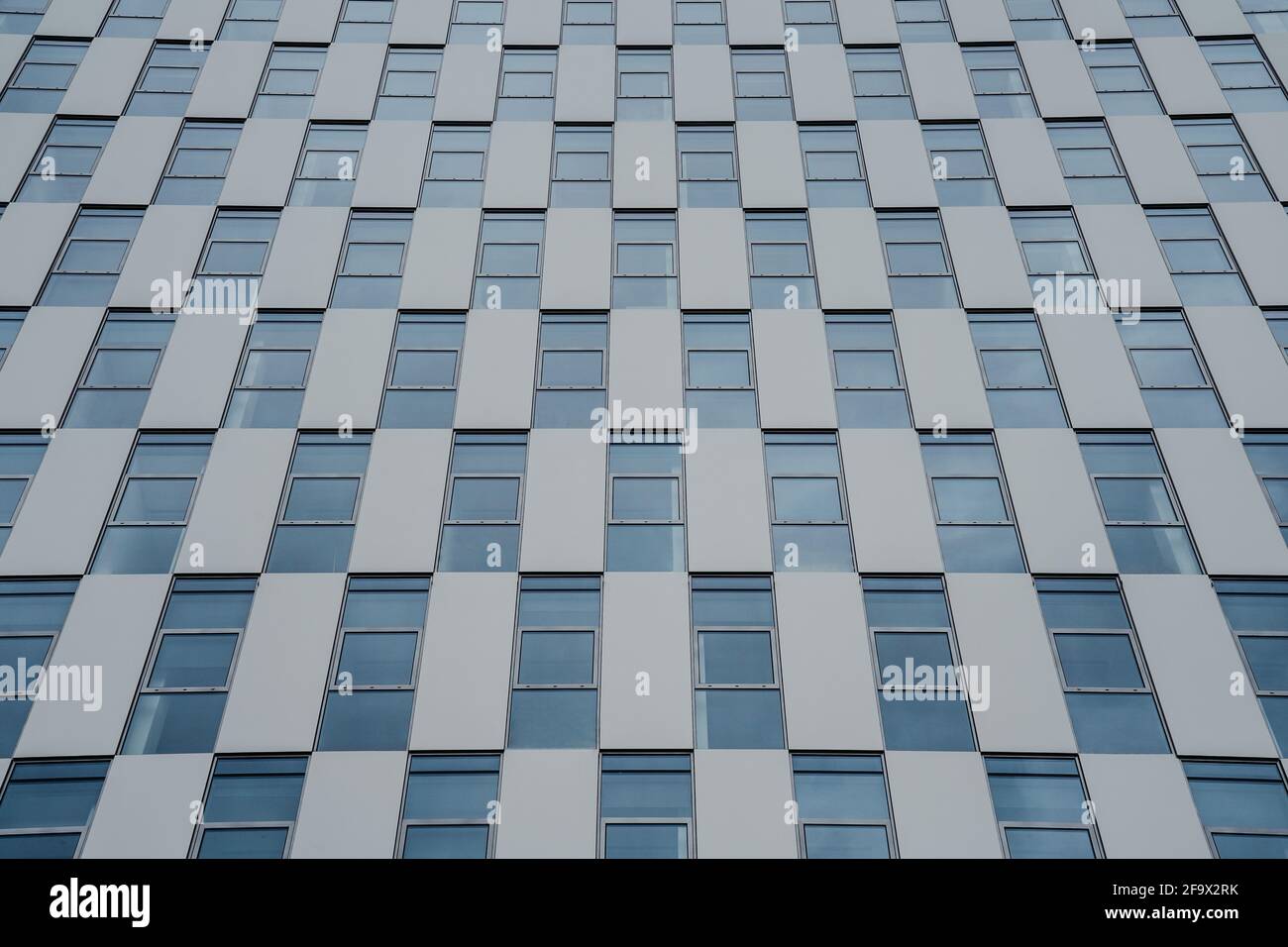 Symmetrical photo of windows on modern building Stock Photo - Alamy