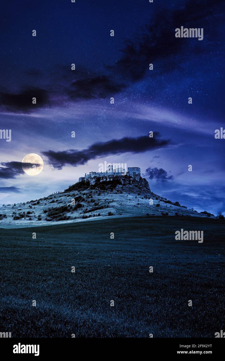 castle on the hill at night. composite fantasy landscape. grassy meadow ...