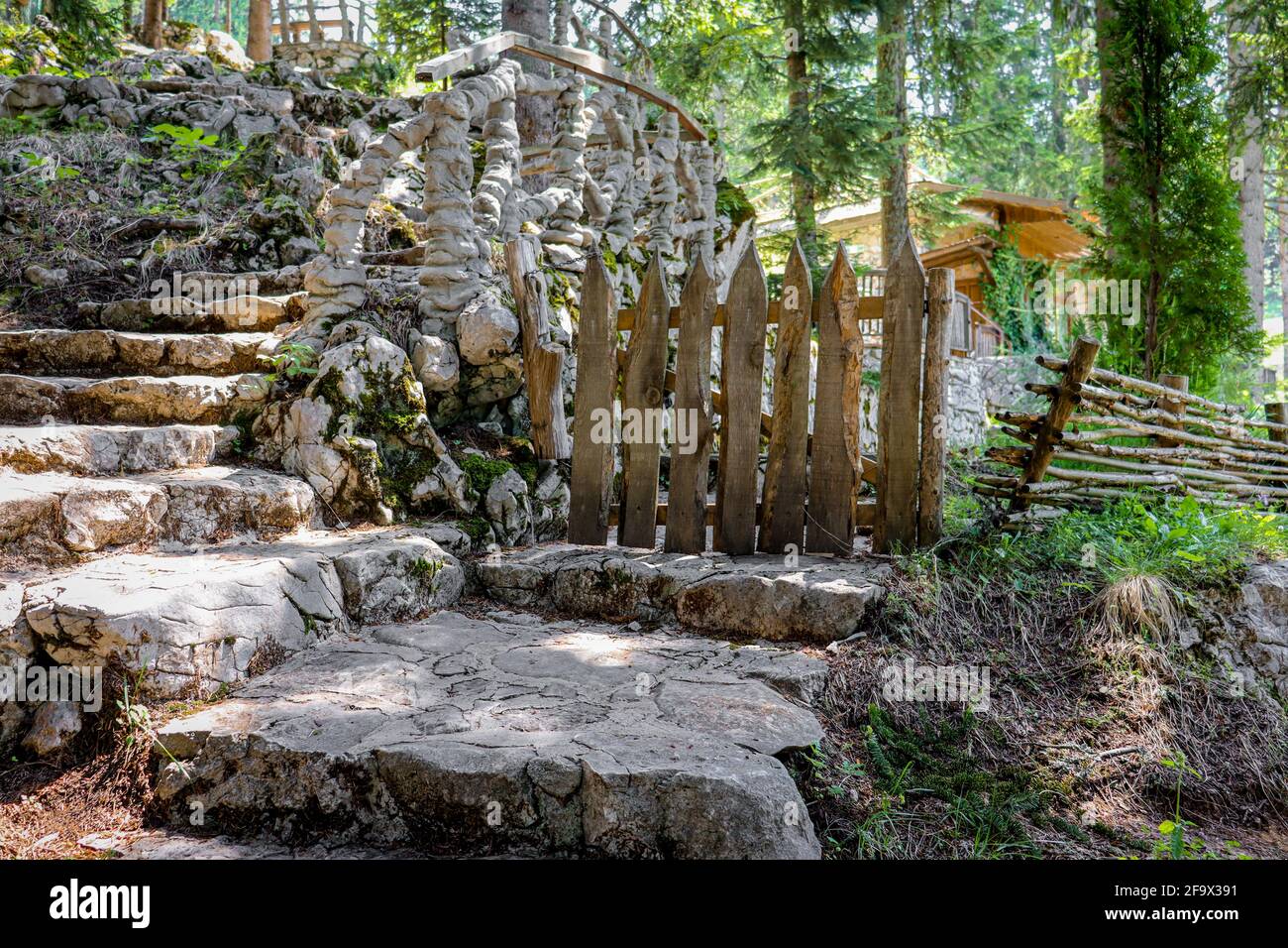 Beautiful view of stony stairs with a wooden fence in the garden Stock ...