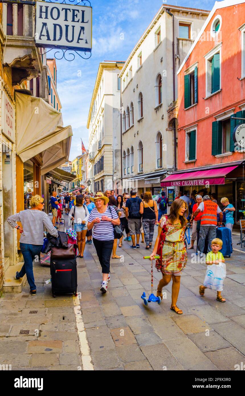 VENICE, ITALY, SEPTEMBER 20, 2015: crowds of tourists are passing ...