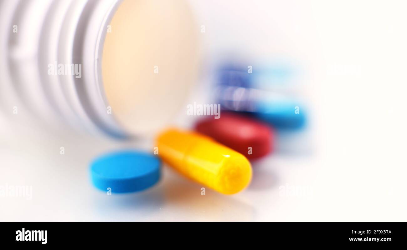 Composition with variety of drug pills and container Stock Photo - Alamy