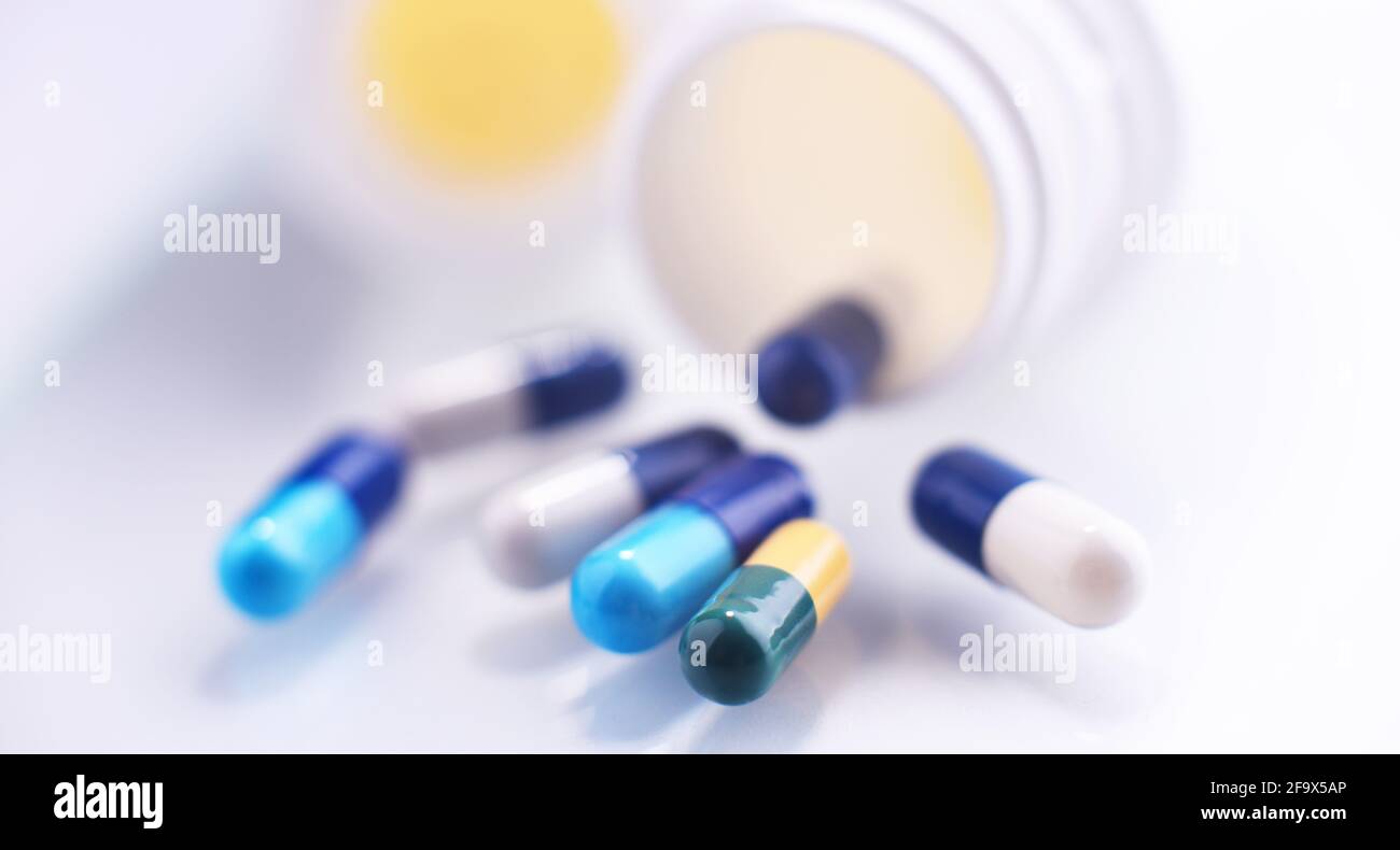 Composition with variety of drug pills and container Stock Photo - Alamy