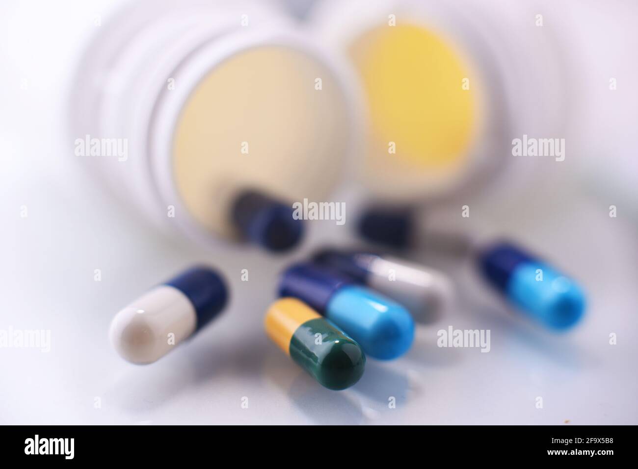 Composition with variety of drug pills and container Stock Photo - Alamy