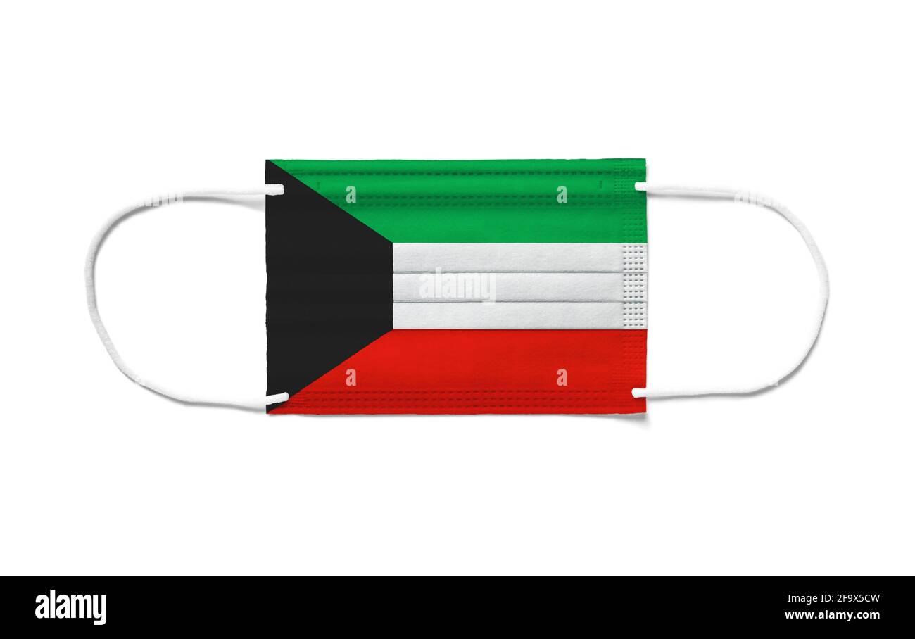 Flag of Kuwait on a disposable surgical mask. White background isolated ...