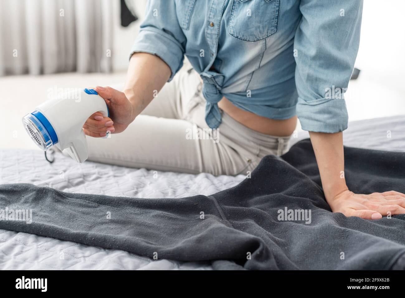 Woman Removing Clothes High Resolution Stock Photography and Images - Alamy