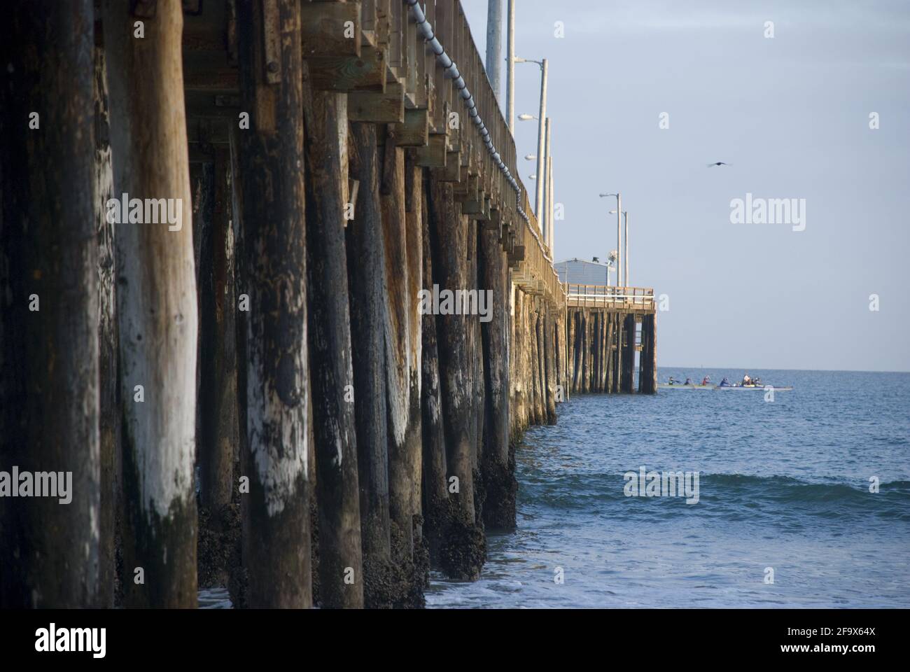View along poles of Avila Beach pier, California Stock Photo - Alamy