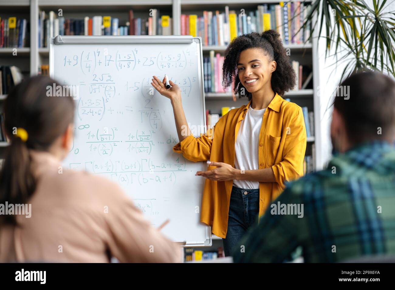 Lecture, teaching concept. African american young smart female teacher ...