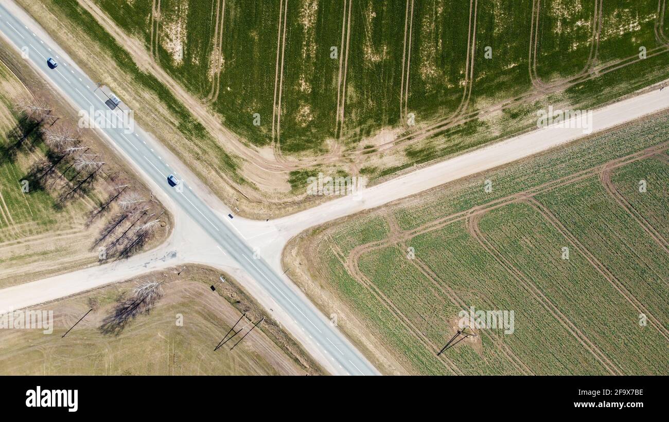 Aerial view of highway in city. Cars crossing interchange overpass ...