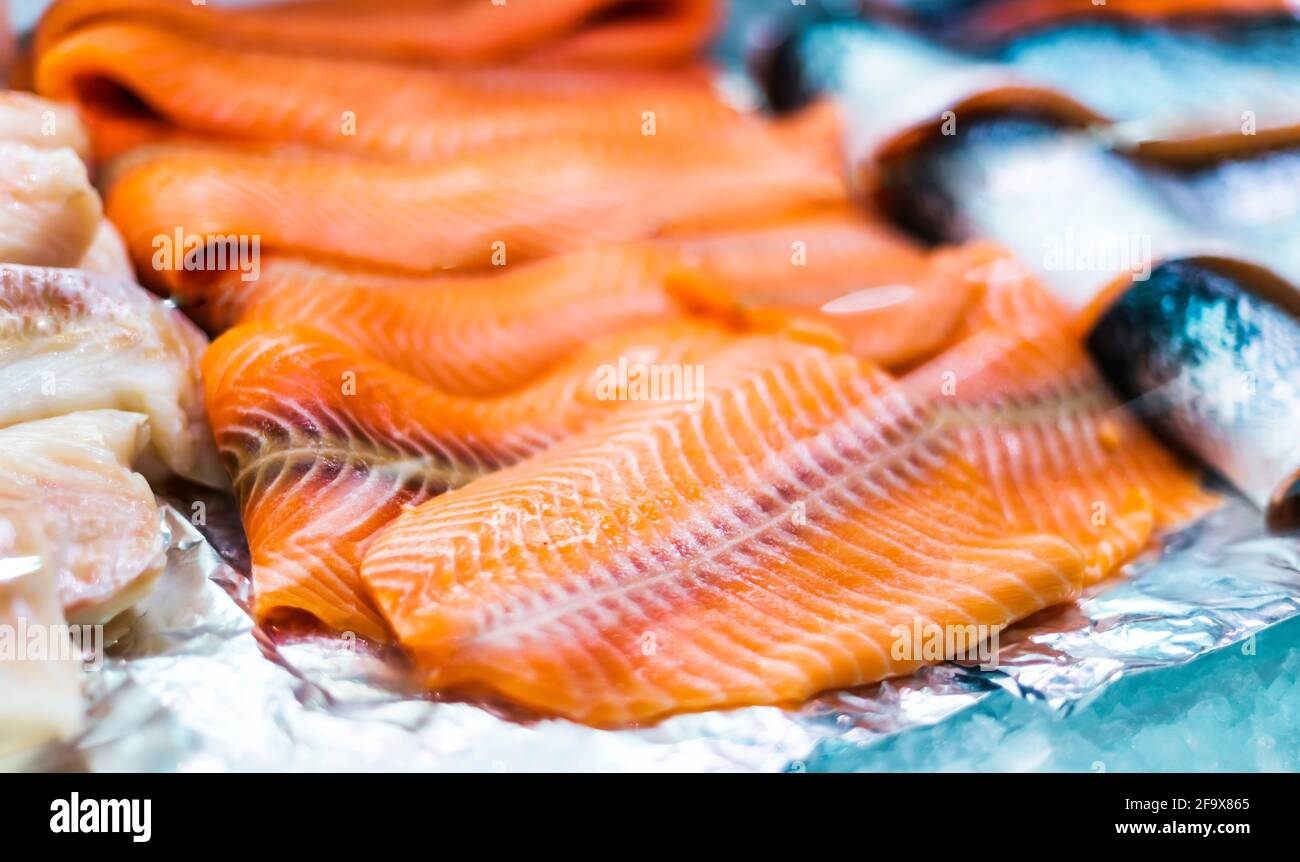Fresh fish fillet put up for sale in a supermarket refrigerator Stock ...