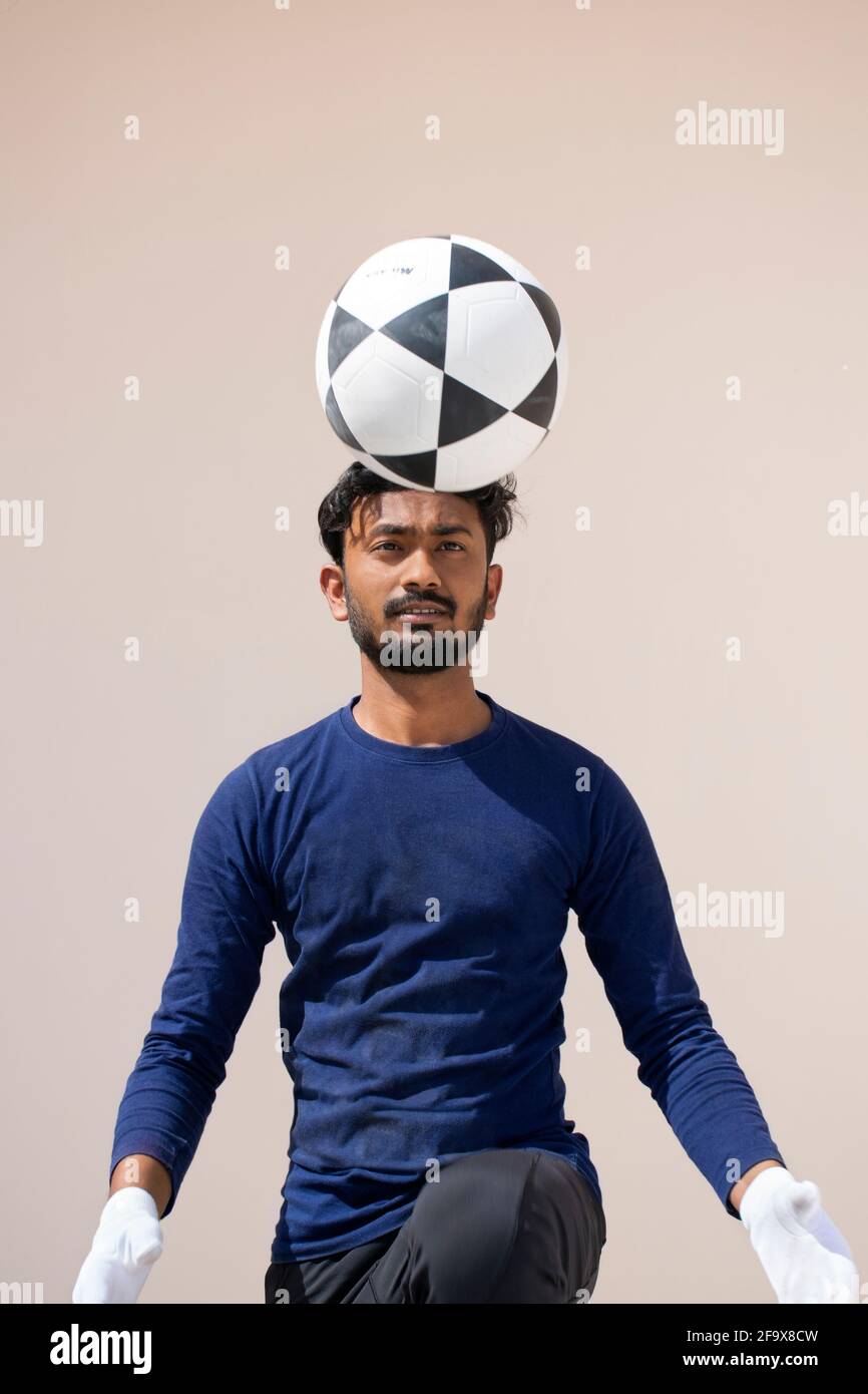 Indian Footballer Playing a football Stock Photo - Alamy