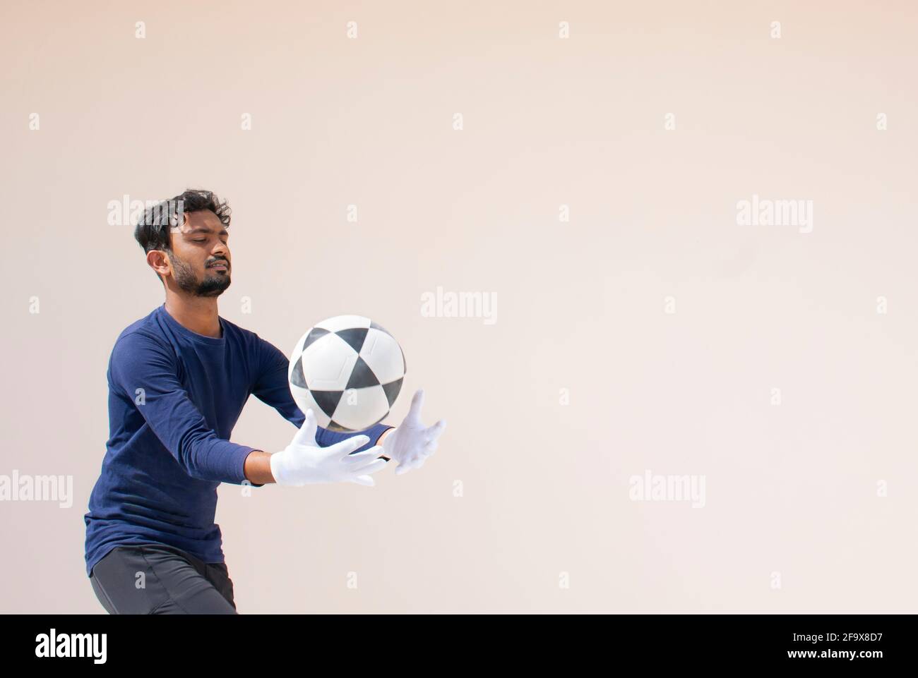 Indian Footballer Playing a football Stock Photo - Alamy