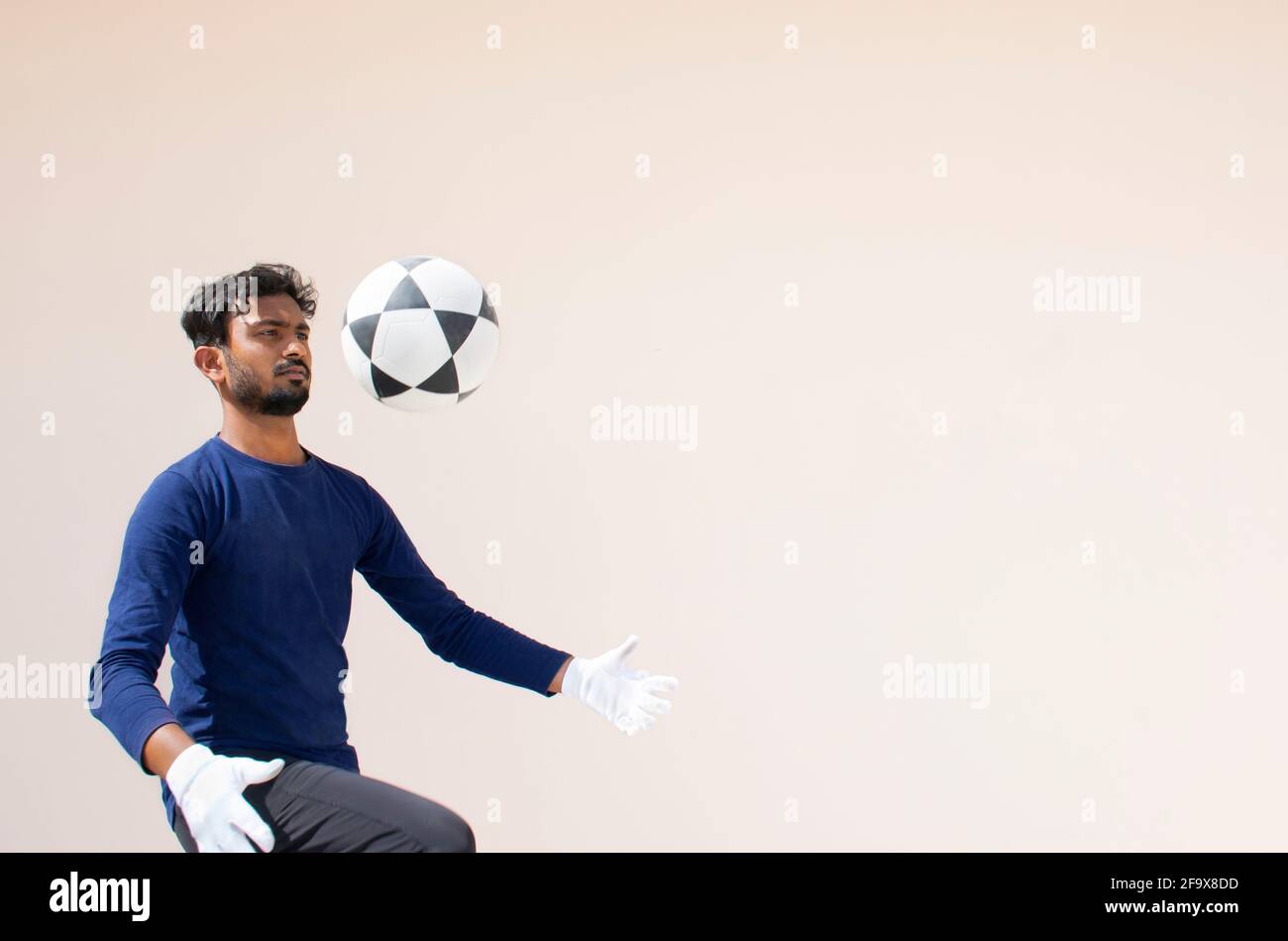 Indian Footballer Playing a football Stock Photo - Alamy
