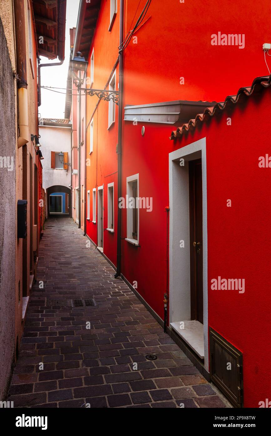Among the colorful alleys of Caorle Stock Photo - Alamy