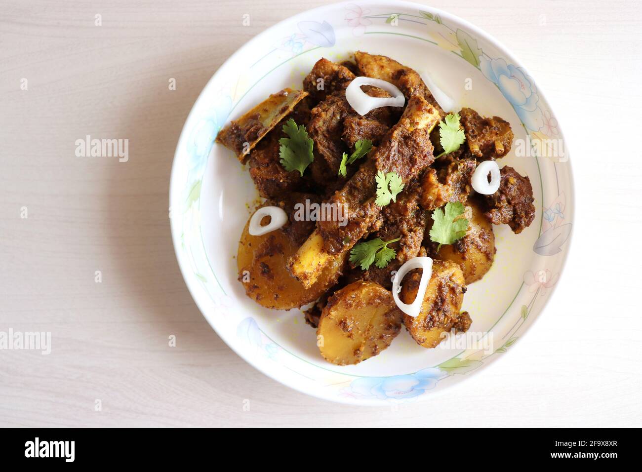 Mutton ghee roast. Goat meat fry with potatoes, also known as Mutton ...