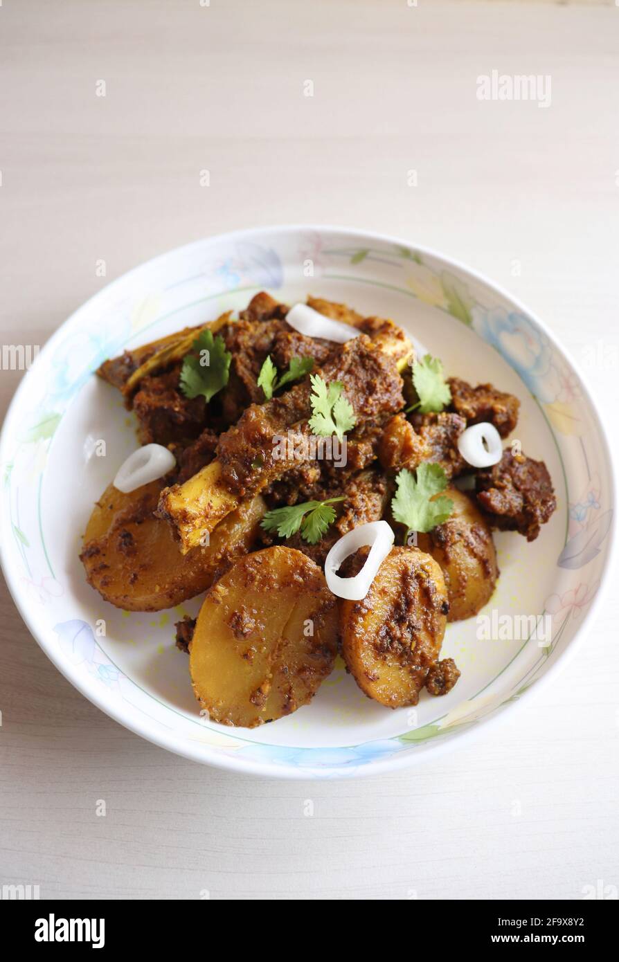 Mutton ghee roast. Goat meat fry with potatoes, also known as Mutton ...