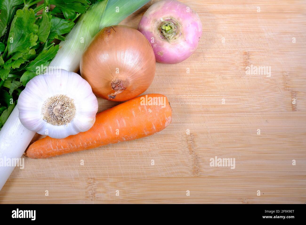 Close up of various vegetables on a wooden and white background Stock ...
