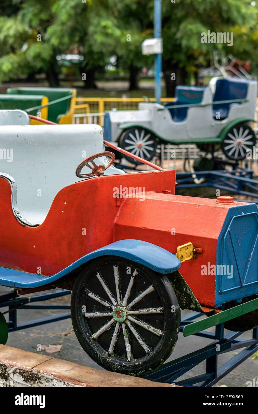 Colorful cars of the merry-go-round carousel in the amusement park ...