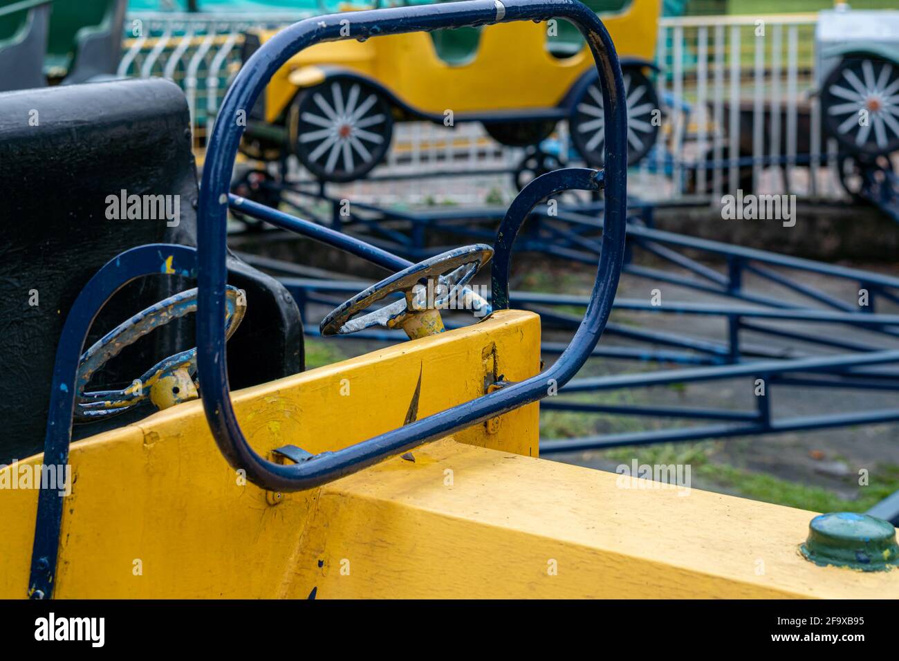 Yellow car of the merry-go-round carousel in the amusement park Stock ...