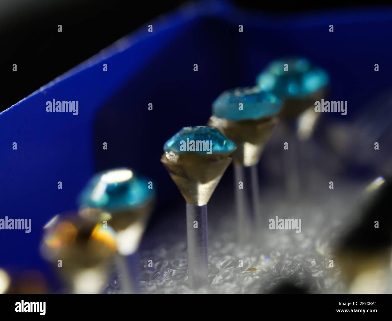 Boxes of different colors with lots of jewelry. Selective focus. Macro ...