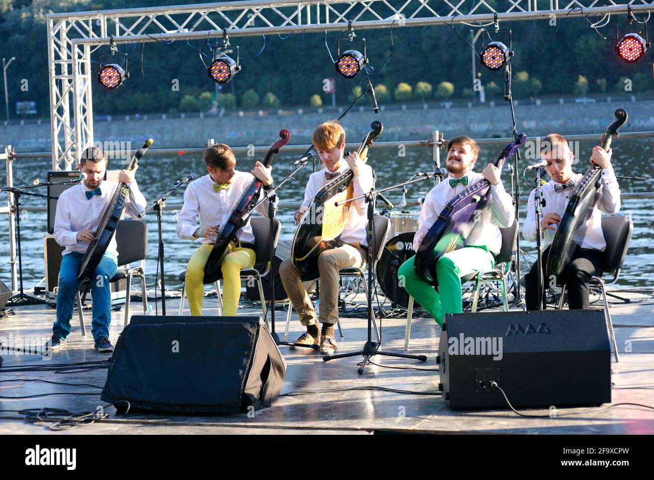 Group of bandurists playing ethno music on the beach, Dnipro river on a ...