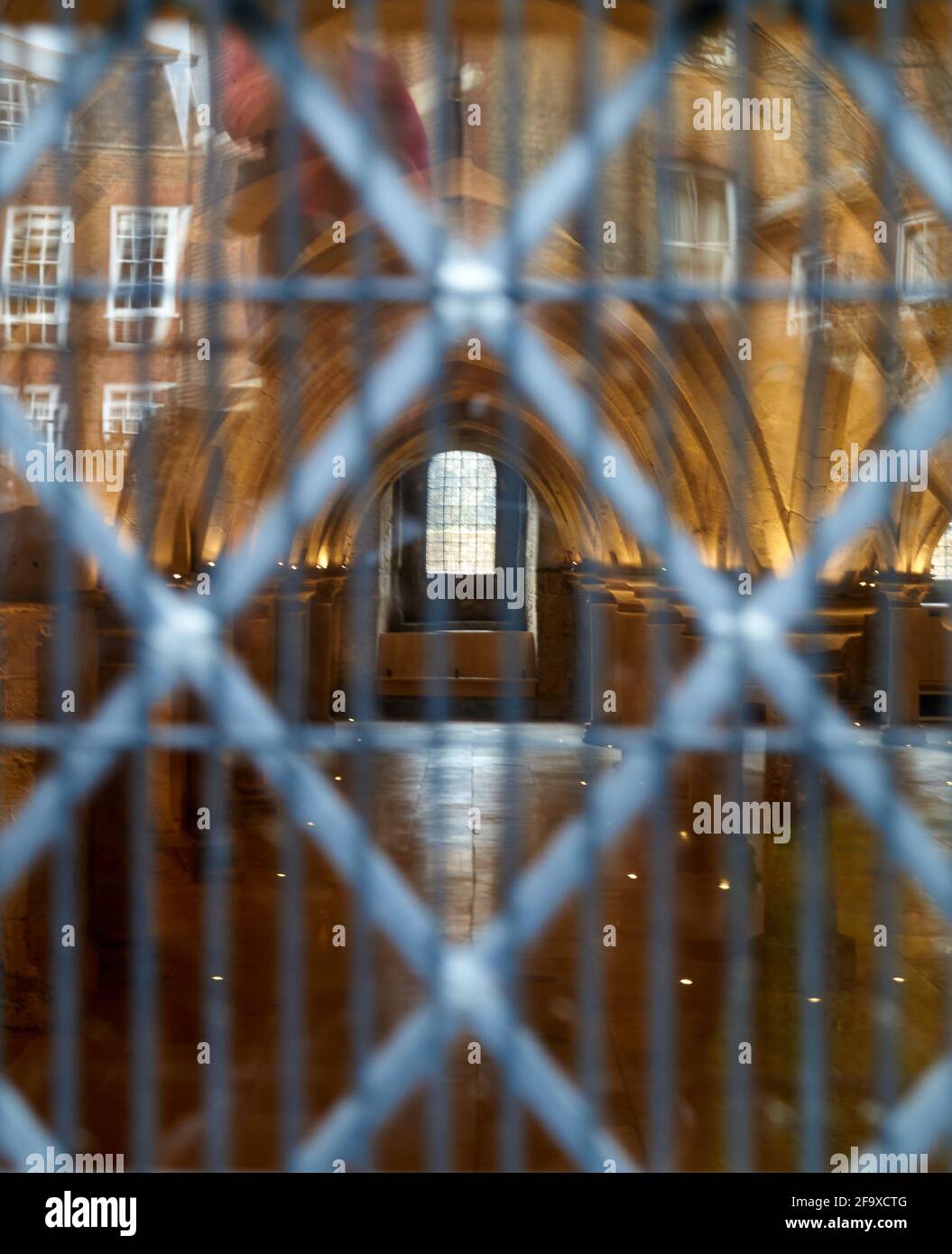 Vertical shot of a cathedral interior behind gate Stock Photo - Alamy