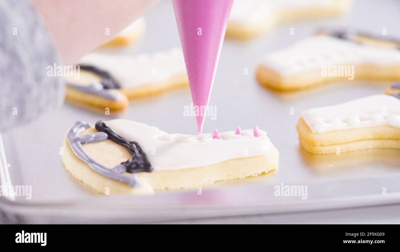 Icing figure skate shaped sugar cookies with royal icing Stock Photo ...
