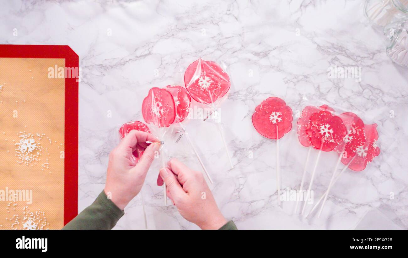 Flat lay. Wrapping large homemade lollipops into clear gift bags Stock ...